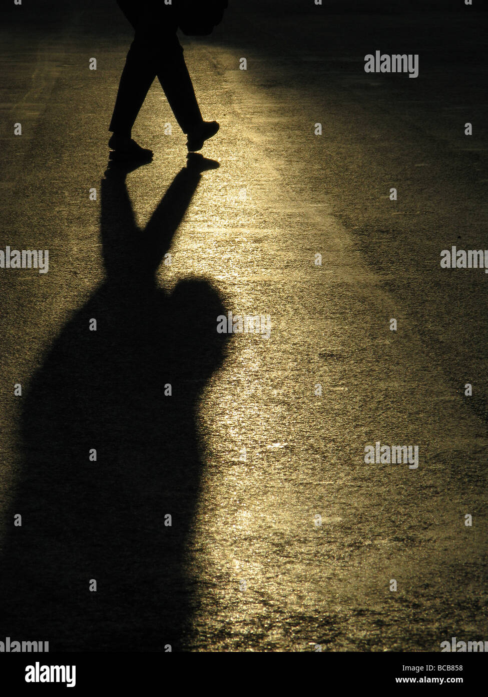 one person walking in empty street road in city town Stock Photo - Alamy