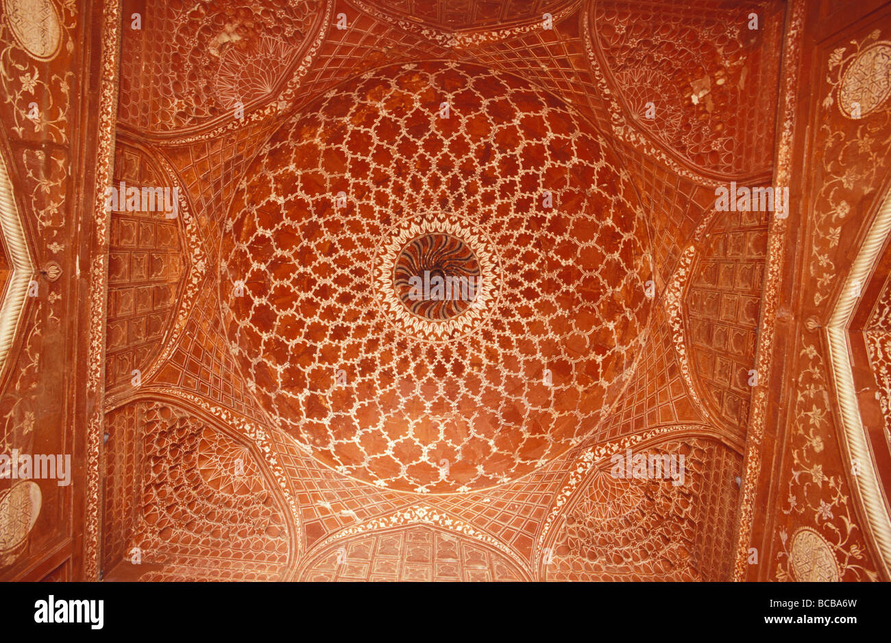 The intricate inlay and carving of a mosque ceiling at the Taj Mahal ...
