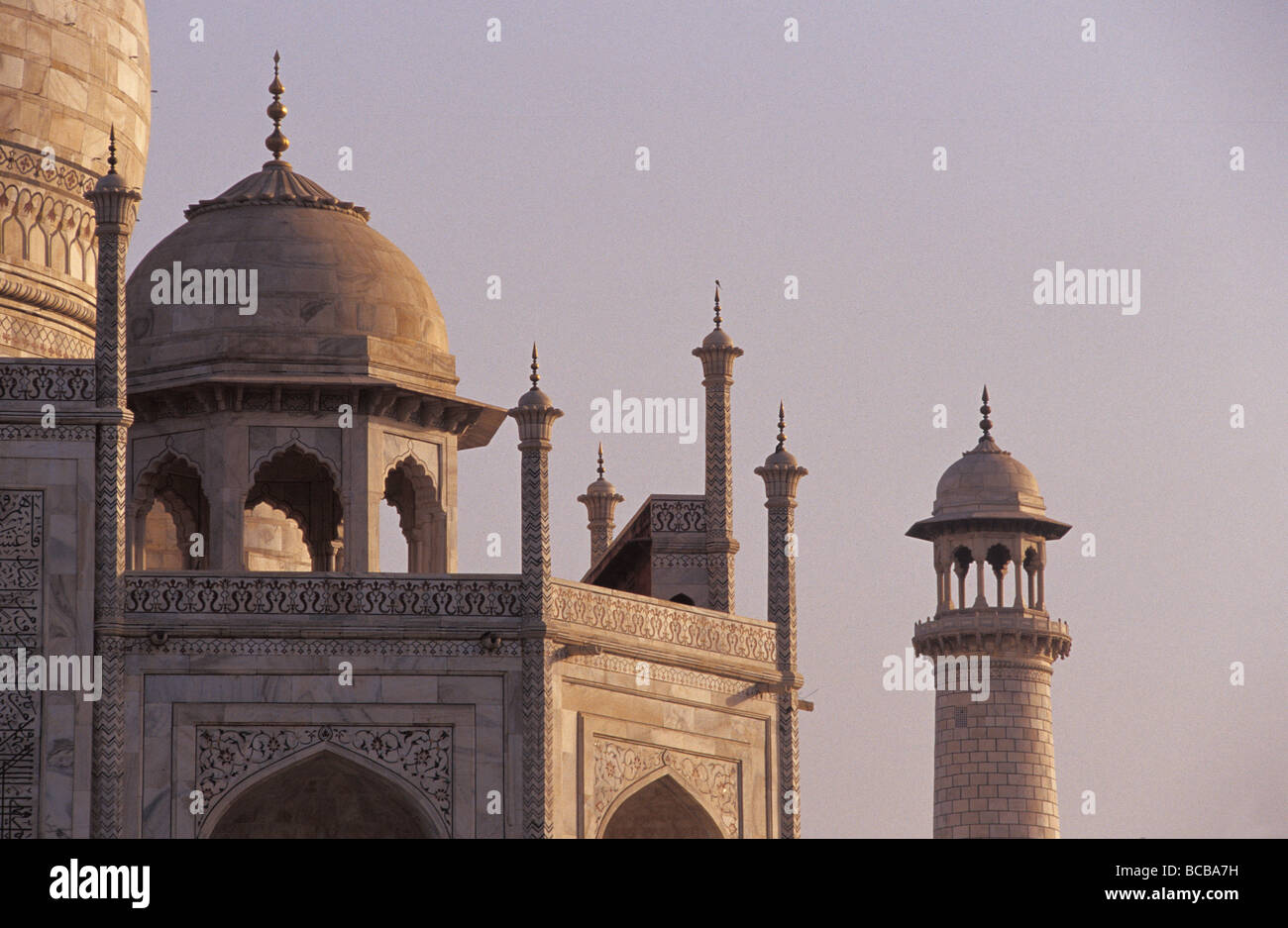 The Taj Mahal marble domes with Pietra Dura inlay and minaret at dawn ...