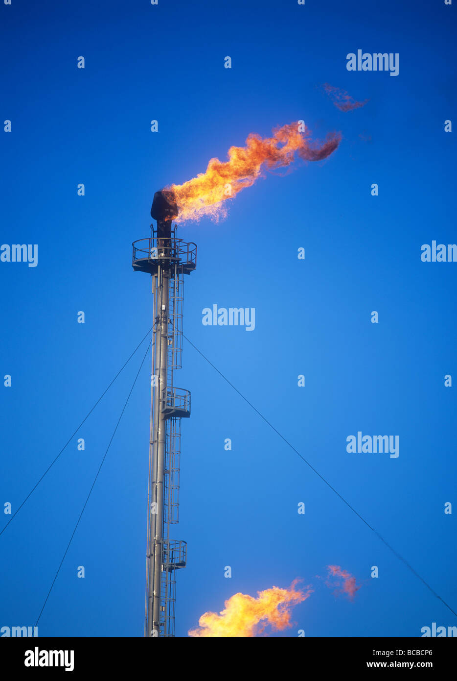 A flare off of gas at a petrochemical works on Teeside UK Stock Photo ...
