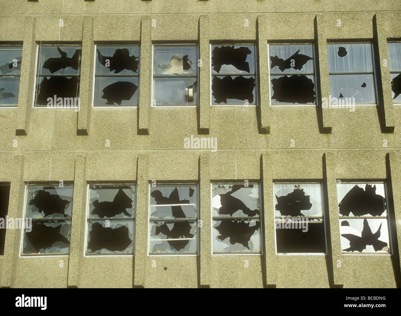 Smashed windows in a derelict building in oldham lancashire UK Stock ...