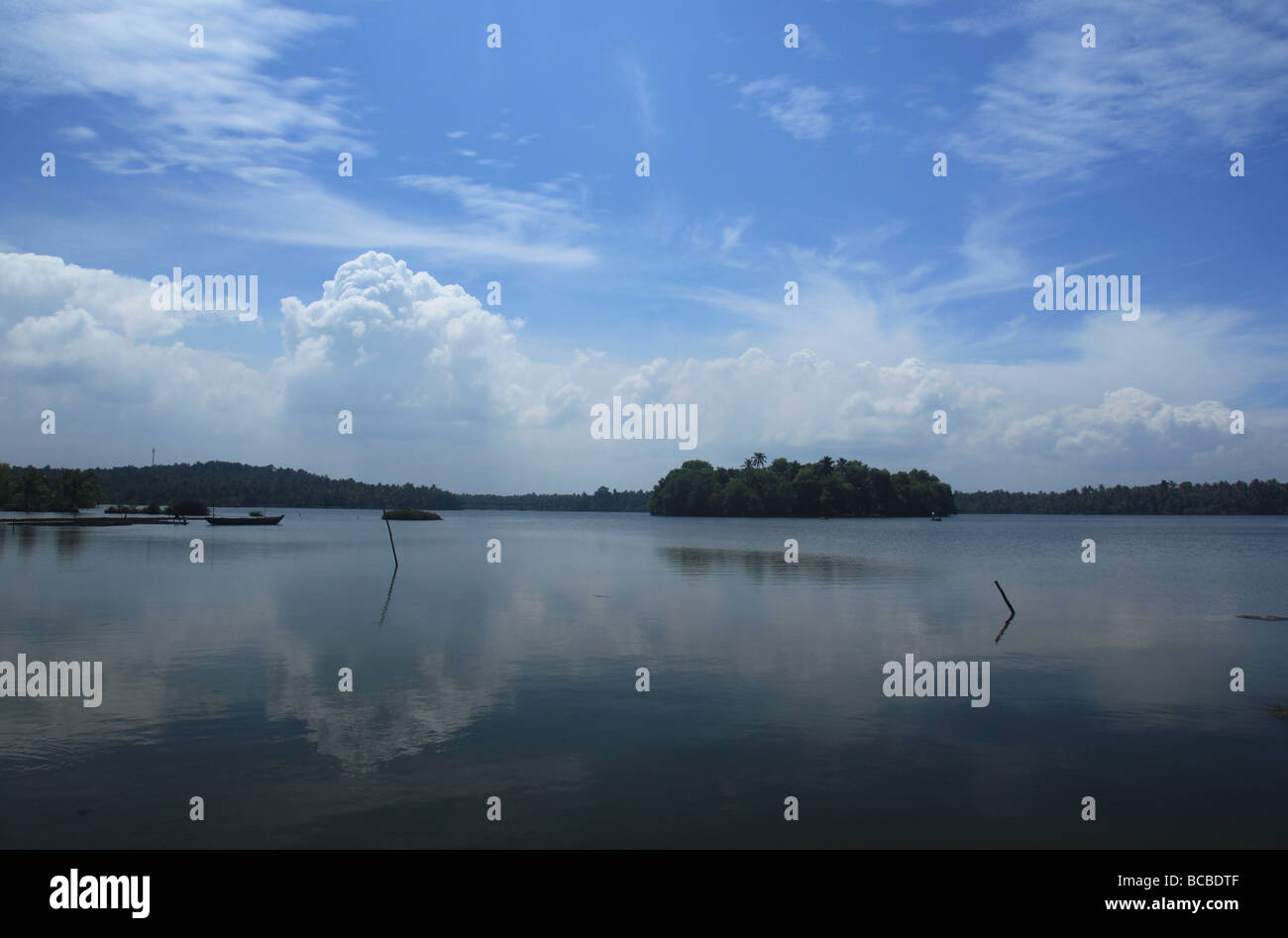 Wooden canoe taking visitors across lake to Ponnumthuruthu island ...