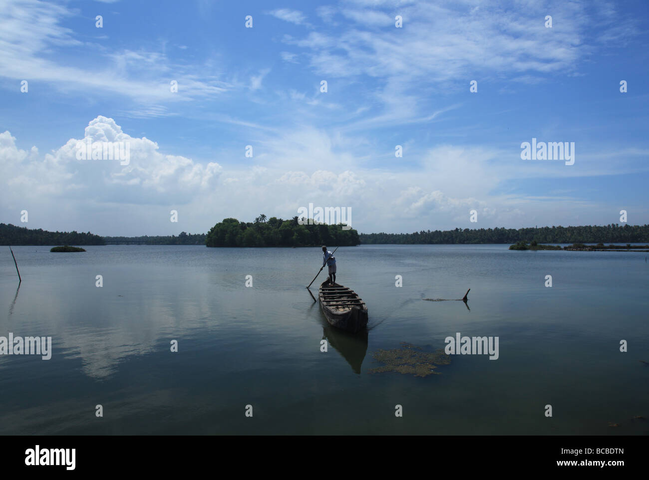Wooden canoe taking visitors across lake to Ponnumthuruthu island ...