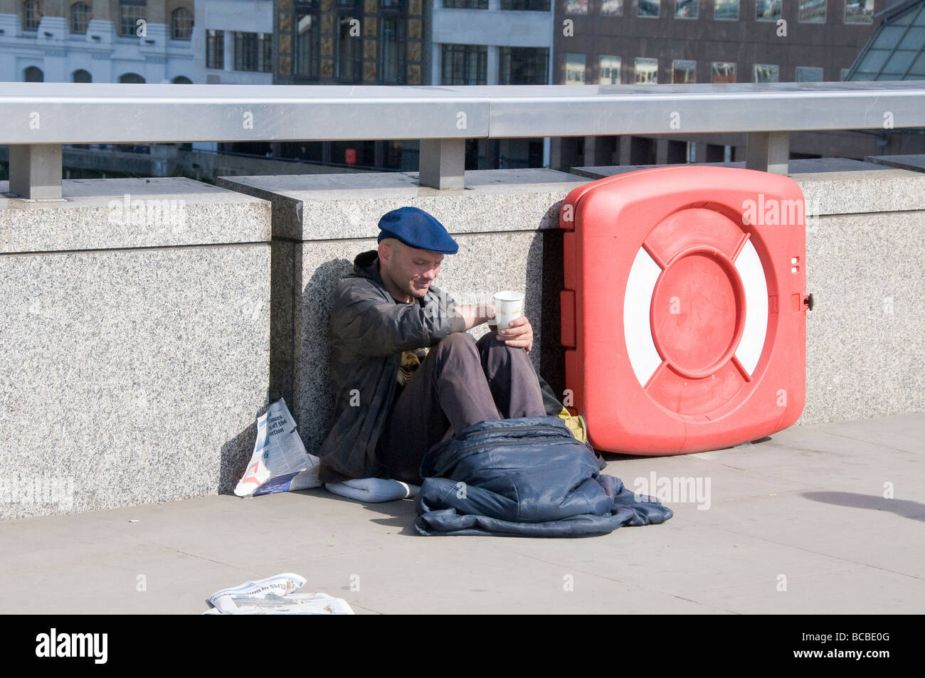 A homeless person on London Bridge in London Stock Photo - Alamy