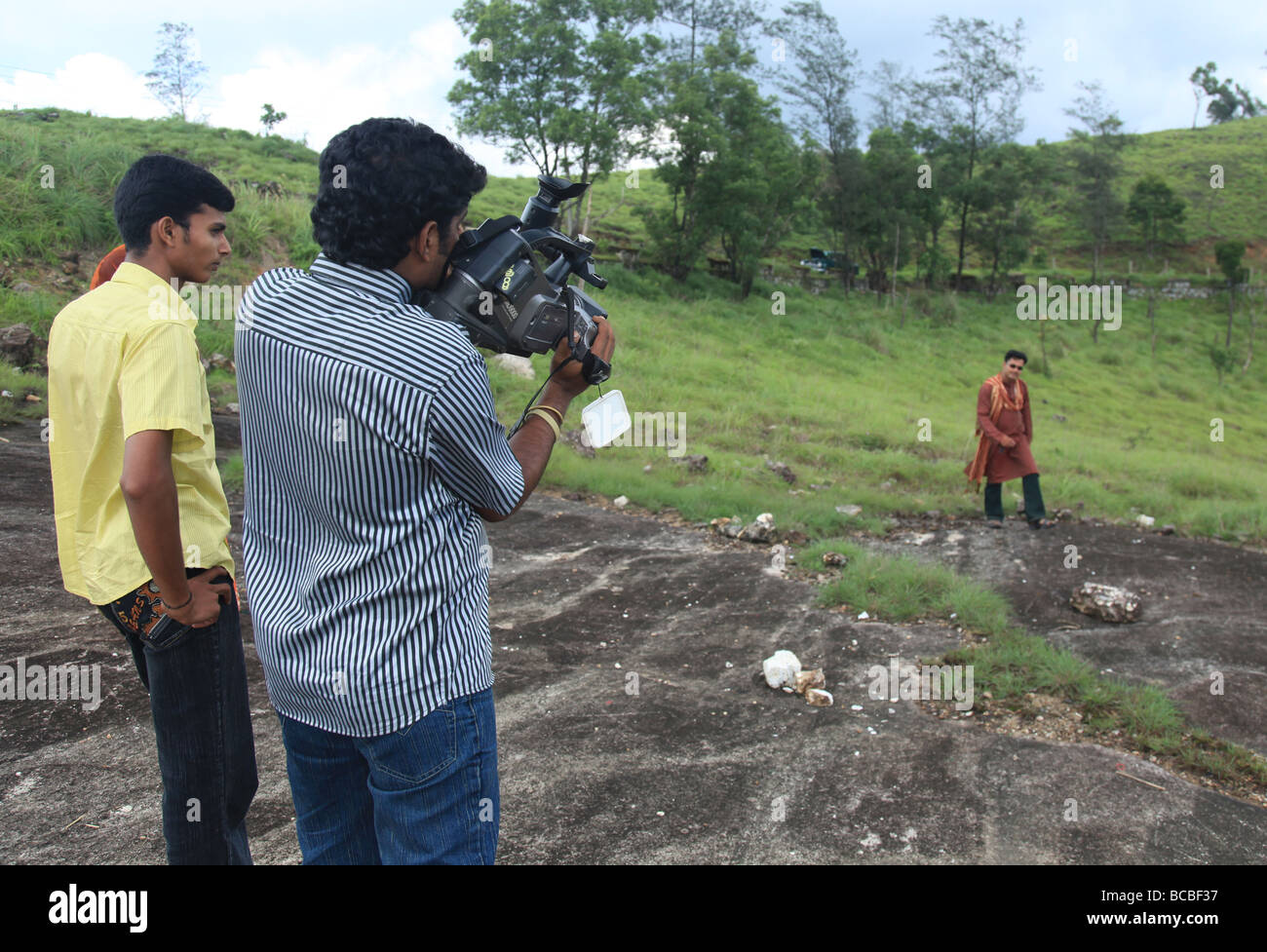 Cameraman filming an Indian couple in the hills of India Stock Photo ...