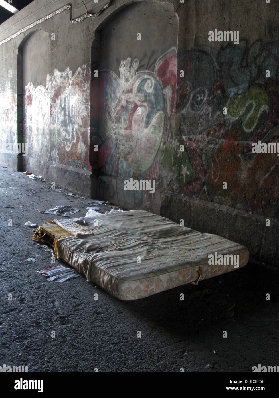 bed of homeless man person under bridge Stock Photo - Alamy