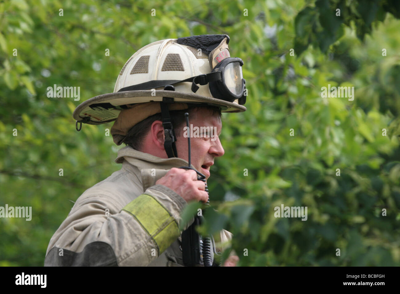 A firefighter Deputy Chief hurring at the scene of a emergency fire ...