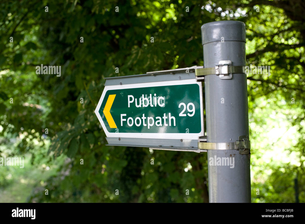 Public Footpath sign with the green trees in the background Stock Photo ...