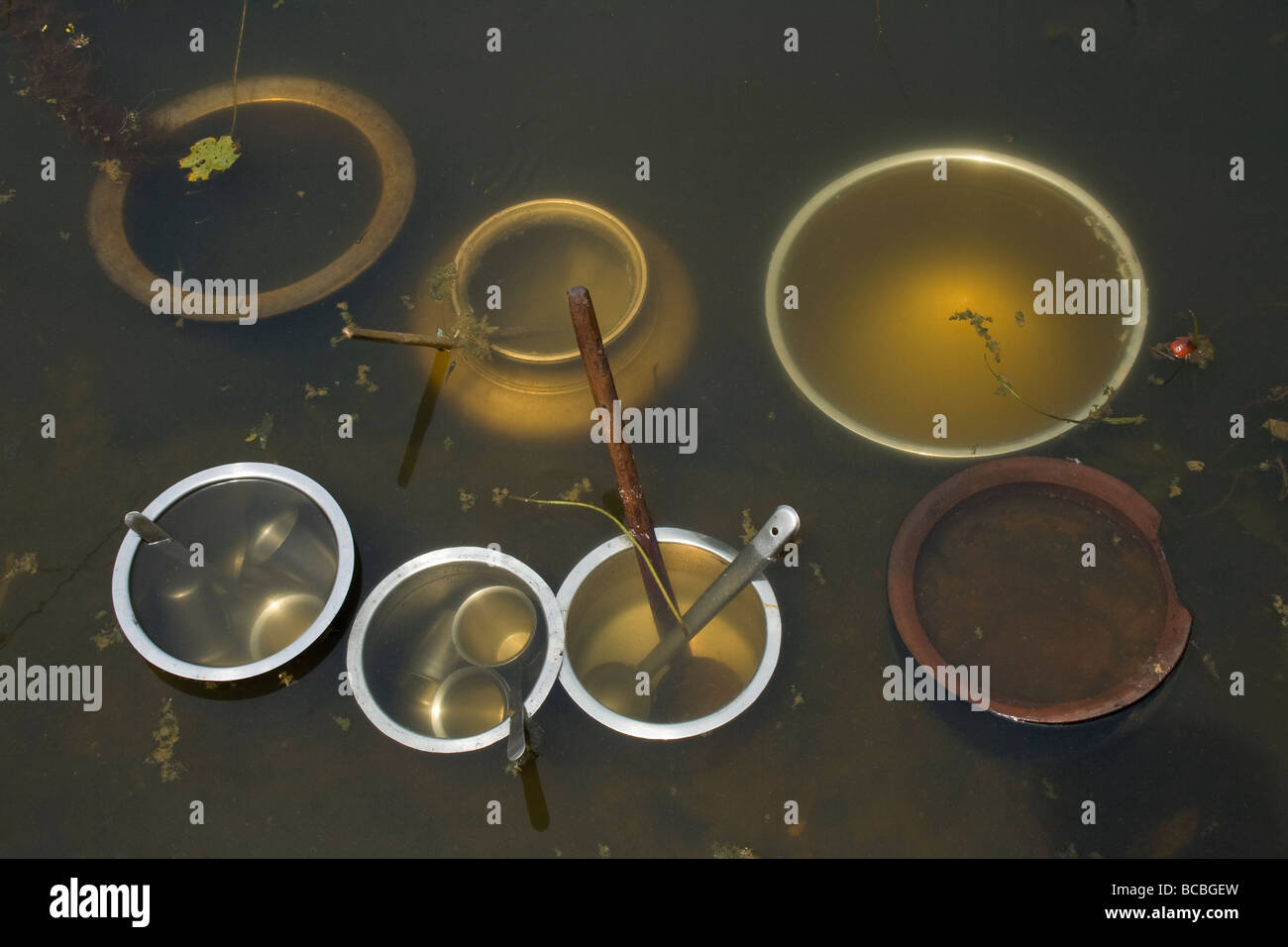 UTENSILS TO BE CLEANED IMMERSED IN WATER Stock Photo - Alamy