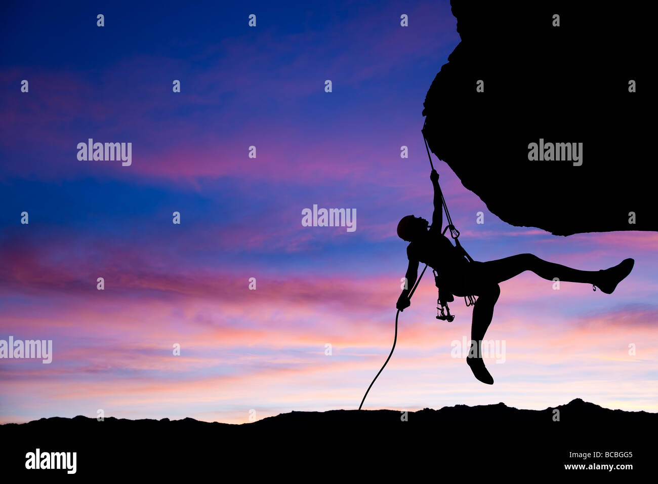 Silhouette rappelling from cliff hi-res stock photography and images ...