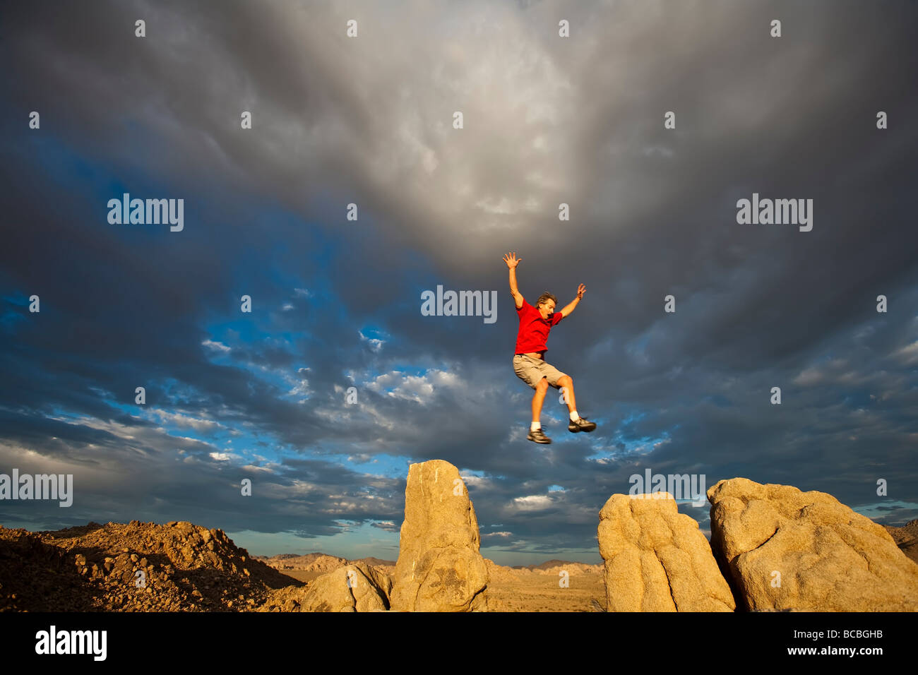 Jump mountain rock leap hi-res stock photography and images - Alamy