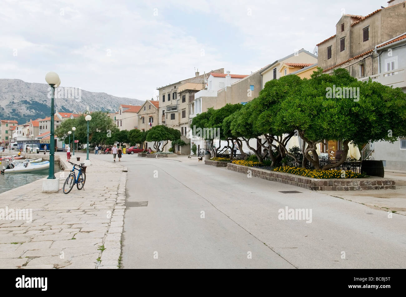The town of baska with the beach and promenade hi-res stock photography ...