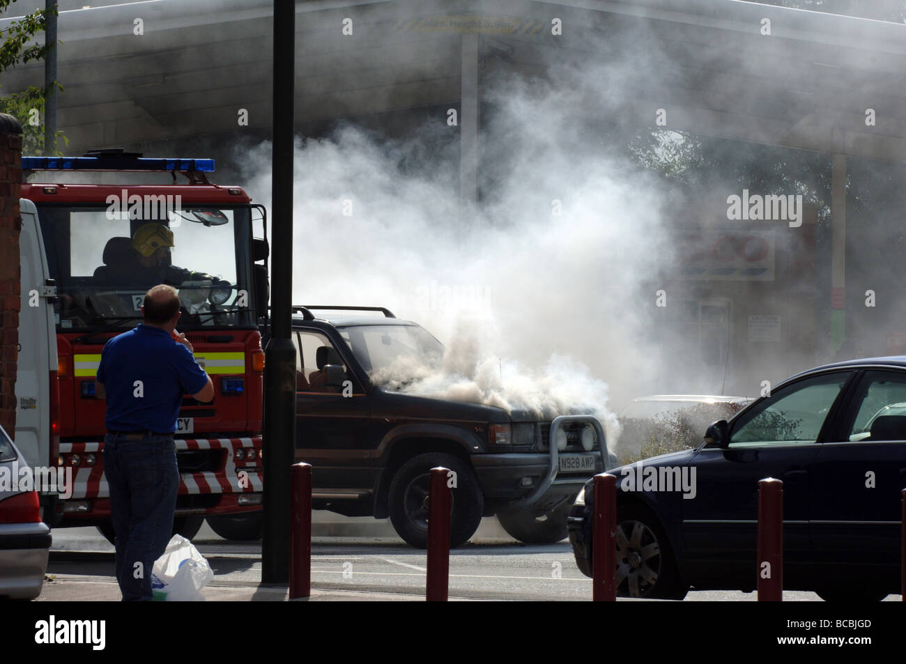 Vauxhall Frontera car fire being put out by fire service in West ...