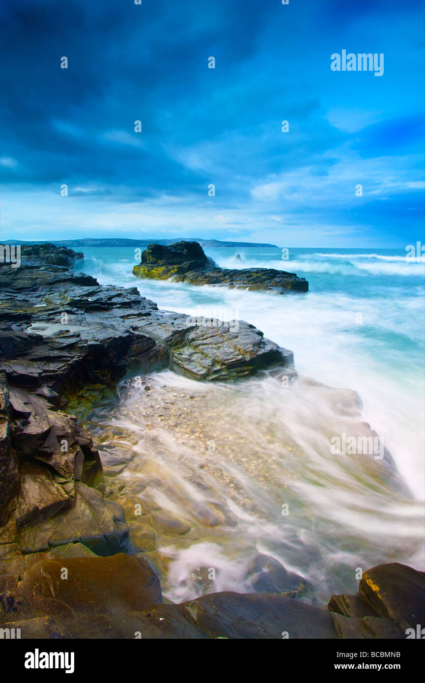 Waves wash up and around the rocks at Godrevy in Cornwall Stock Photo ...