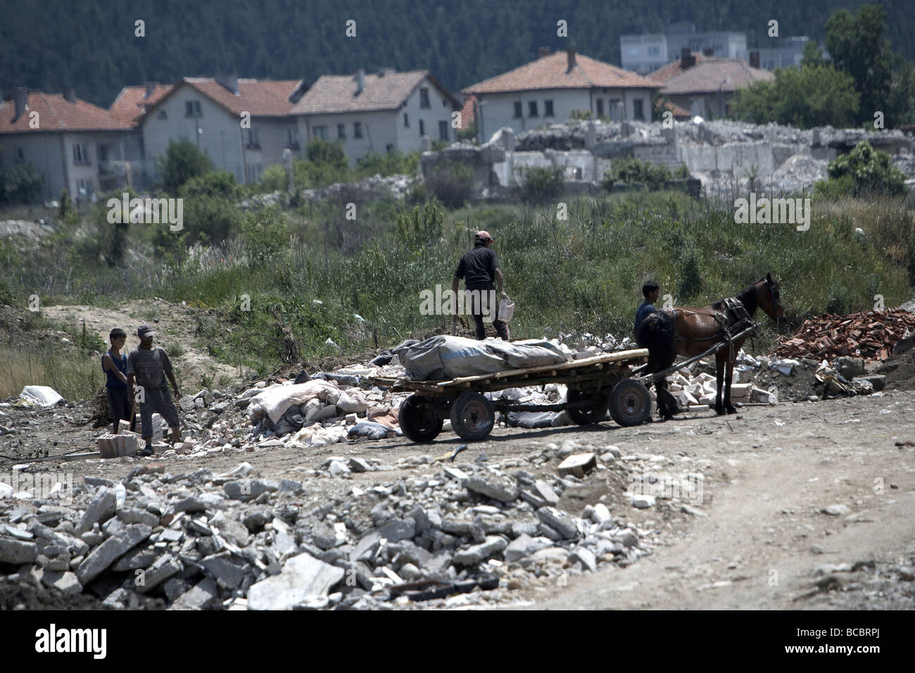 Adults and children scavenging for rubbish using a horse and cart ...