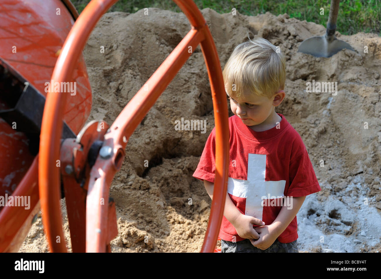 Little child blond boy playing with mortar Stock Photo - Alamy