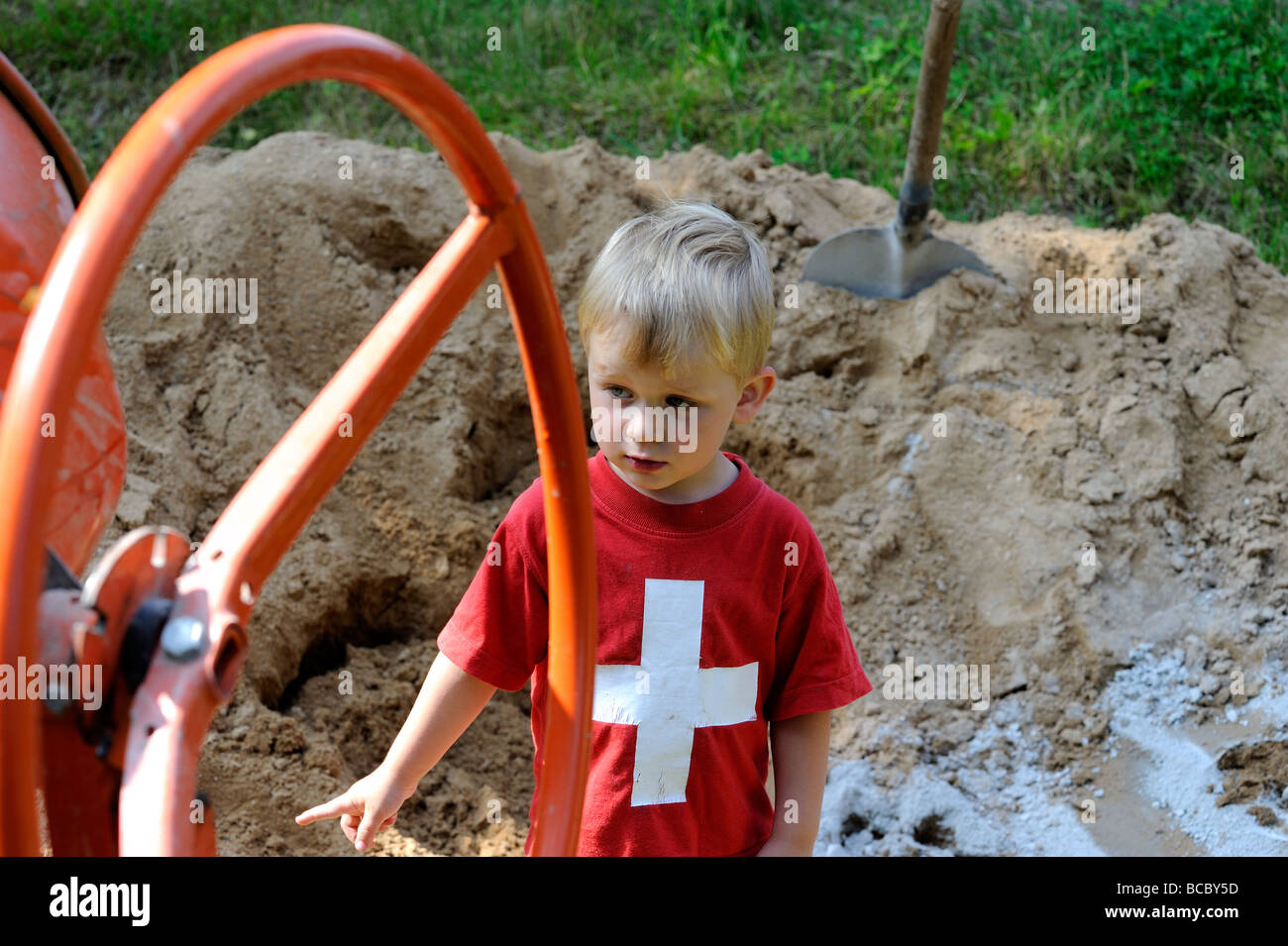 Little child blond boy playing with mortar Stock Photo - Alamy