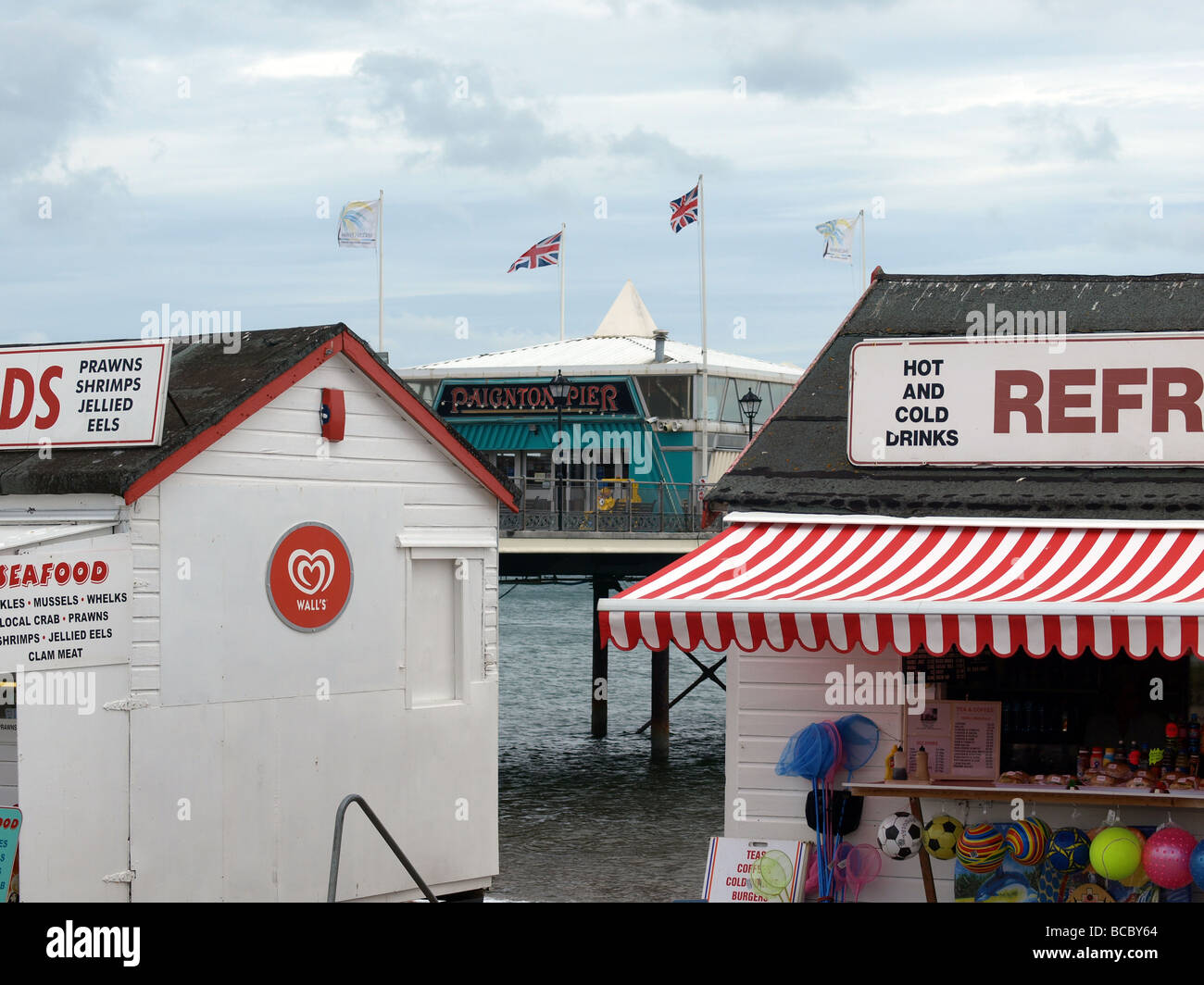 Beach refreshment bars with Paignton pier in the background,Devon Stock ...