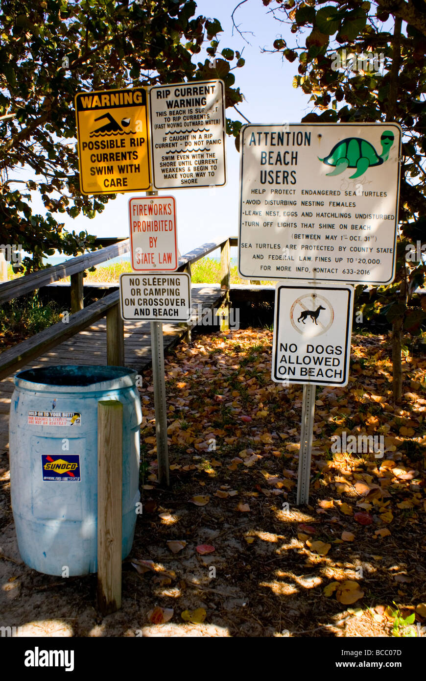 Warning signs adjacent to boardwalk to beach between Cape Canaveral and ...