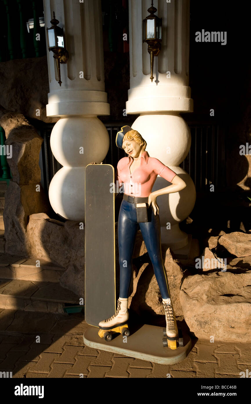 Fifties style rollerskating waitress mannequin holding blank sign ...