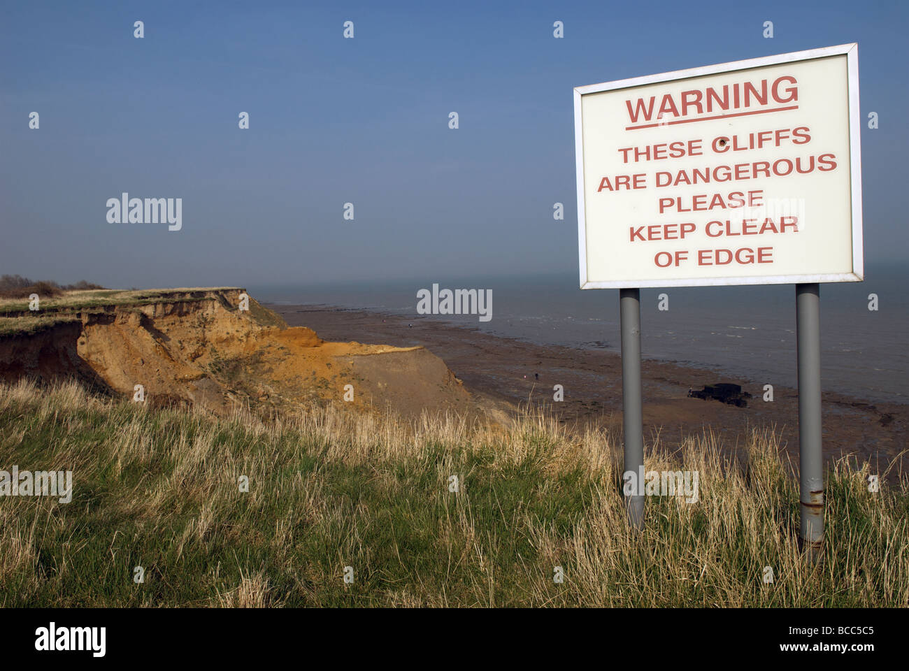 Warning sign telling visitors to keep clear of the cliff edge Stock ...