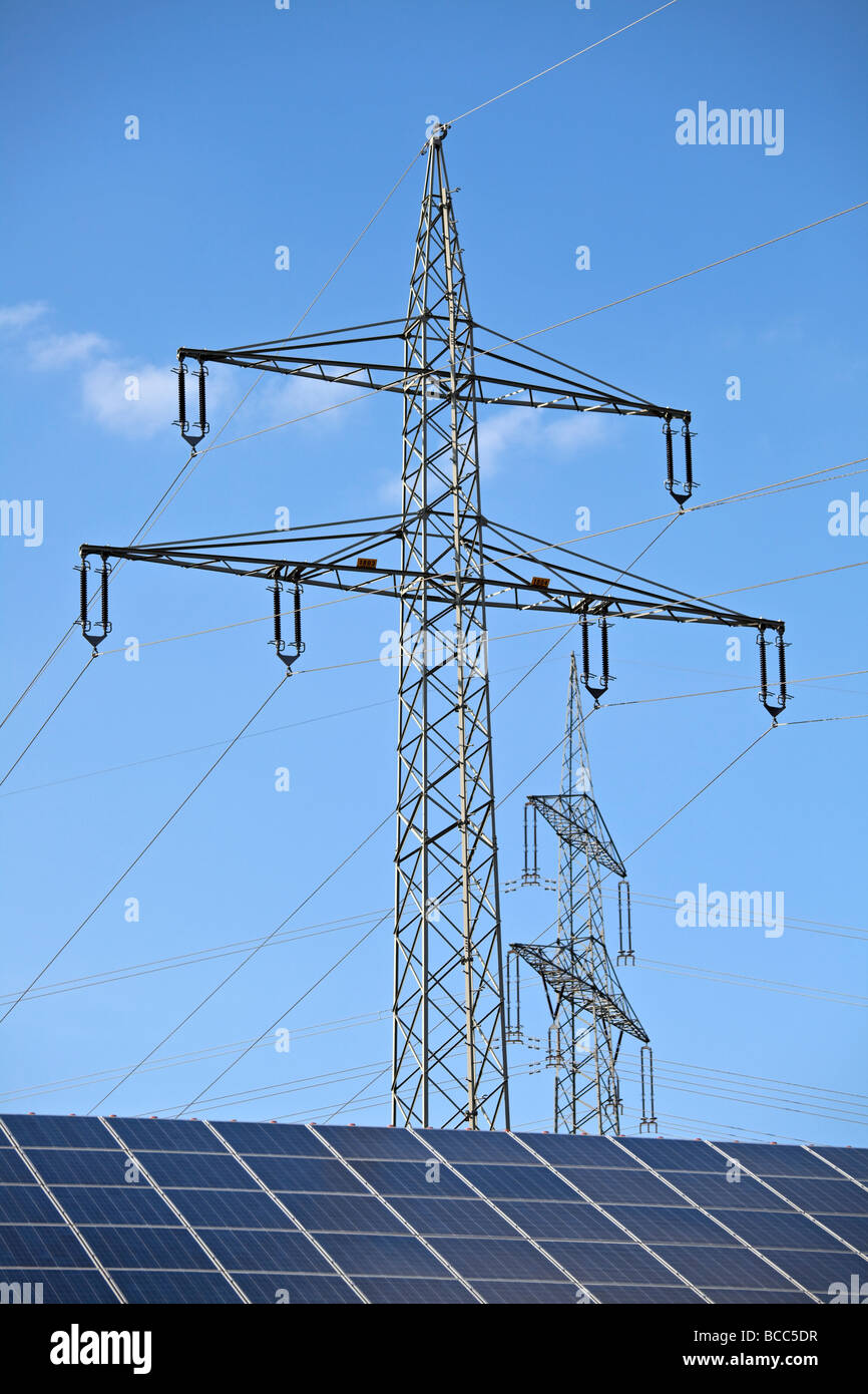 solar panels and a pylon on a sunny day Stock Photo - Alamy