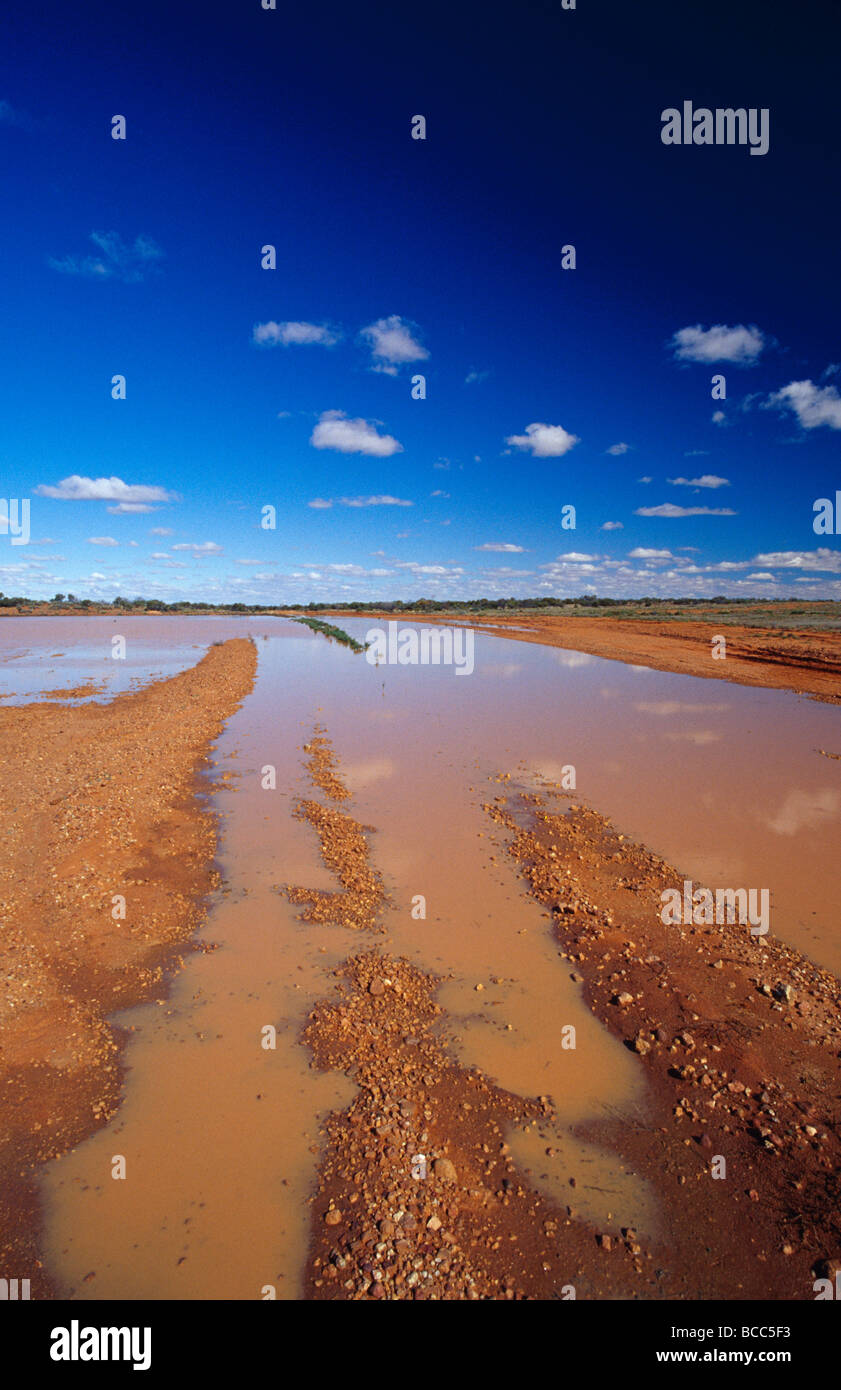 An isolated impassable desert track following a rare flood Stock Photo ...