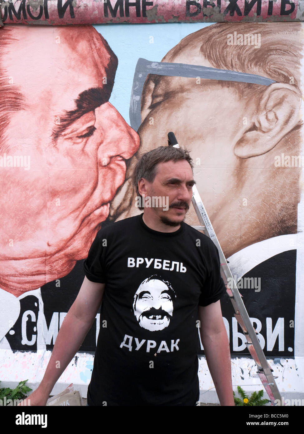 Russian artist Dimitry Vrubel repainting his famous original mural of ...