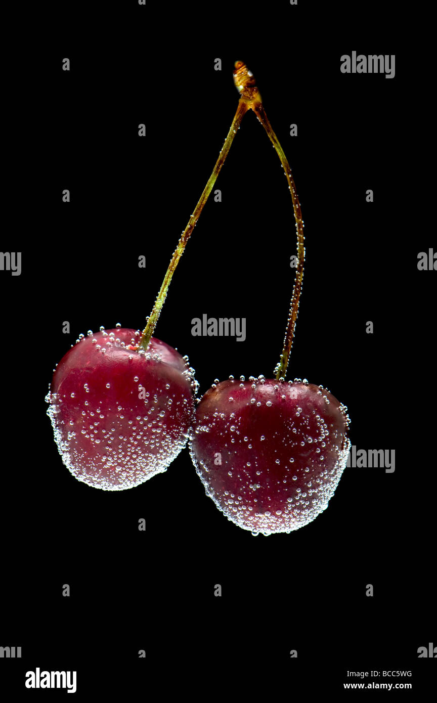 object on black food cherries in water Stock Photo - Alamy