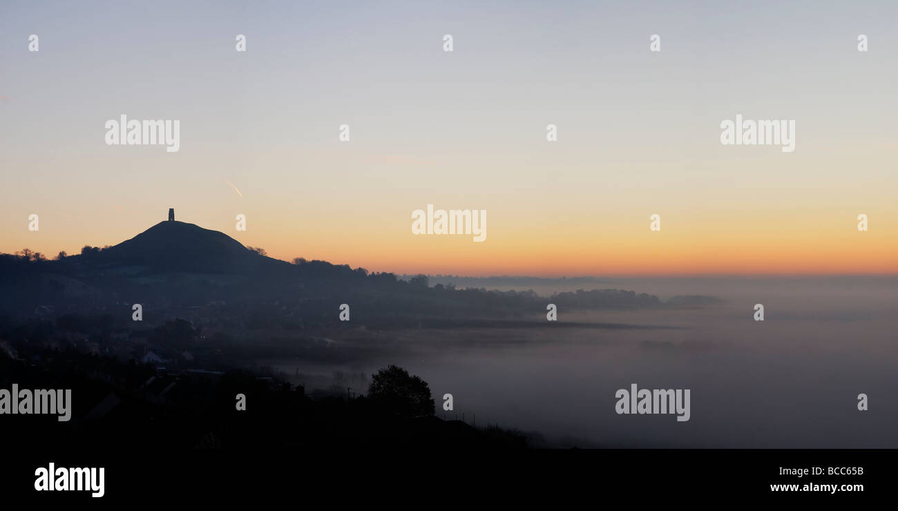 Glastonbury Tor above a sea of mist on a cold winter morning. High ...