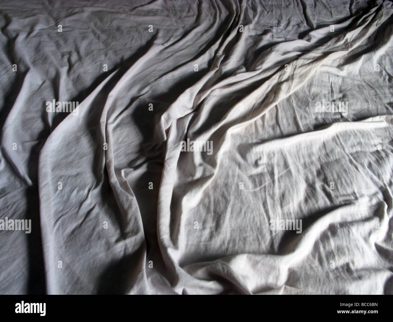 creases on bed sheet in dark room Stock Photo - Alamy