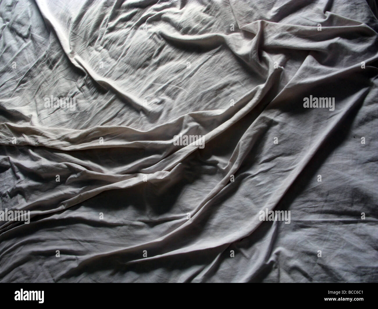 creases on bed sheet in dark room Stock Photo - Alamy