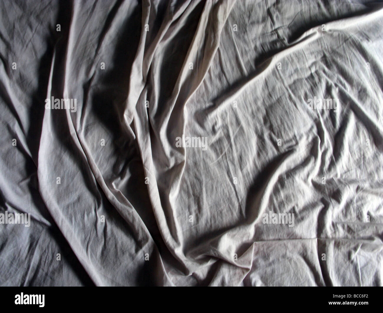 creases on bed sheet in dark room Stock Photo - Alamy