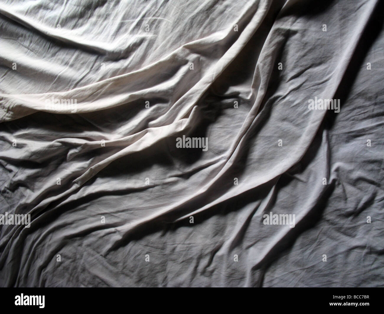 creases on bed sheet in dark room Stock Photo - Alamy