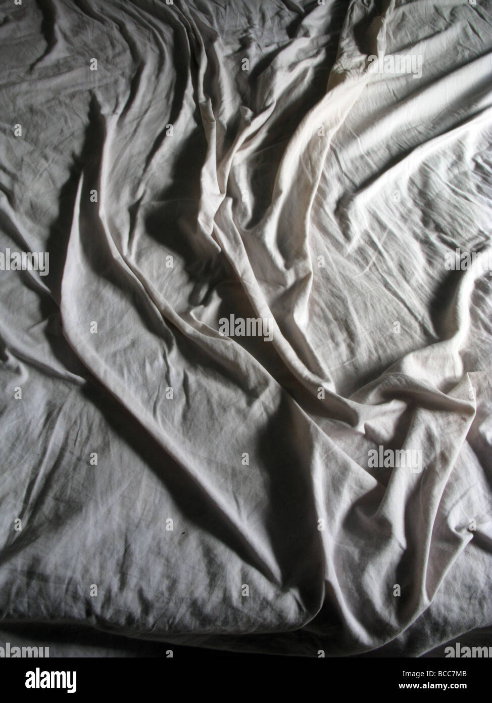 creases on bed sheet in dark room Stock Photo - Alamy