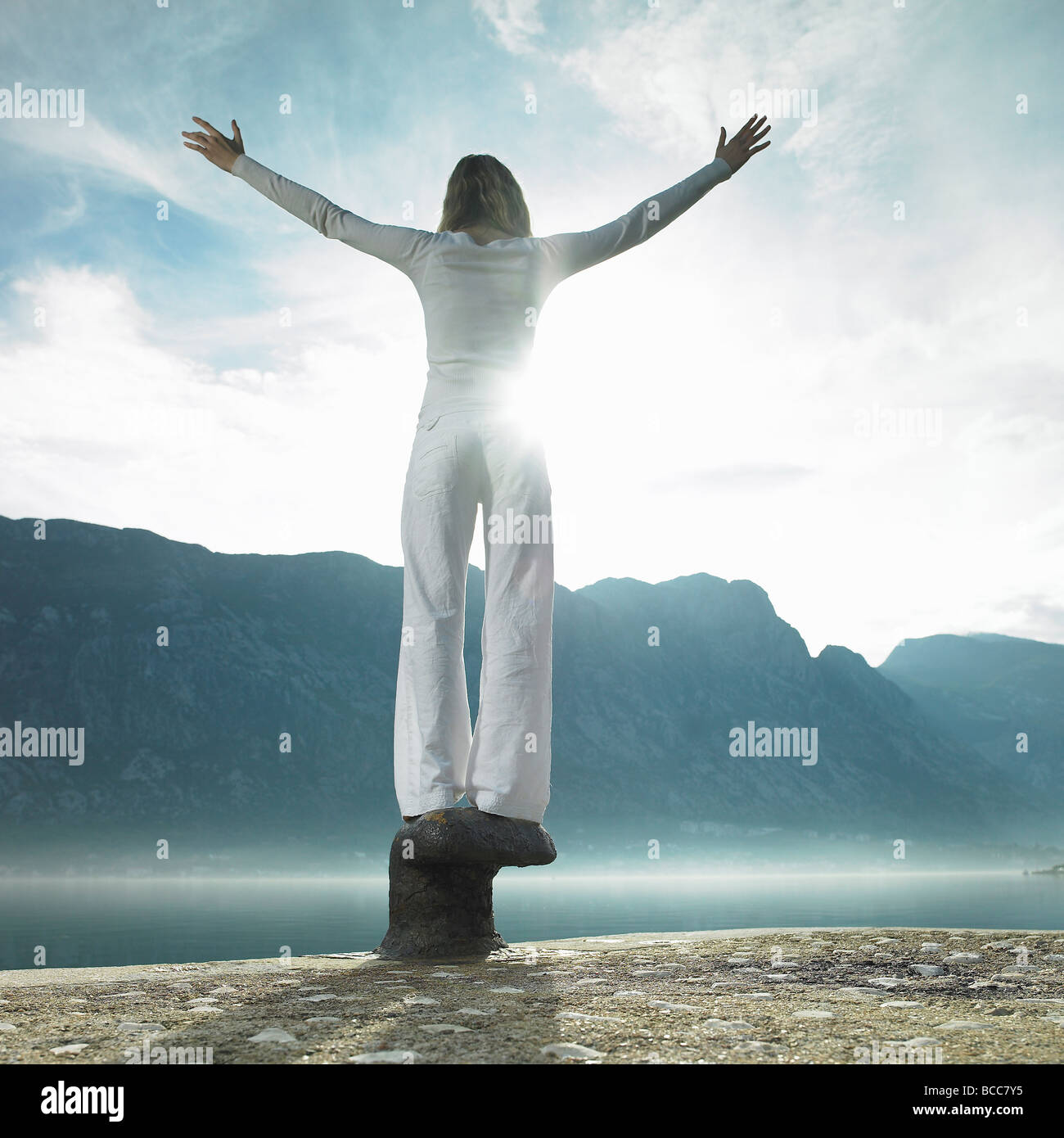 woman wearing white arms outstretched Stock Photo - Alamy