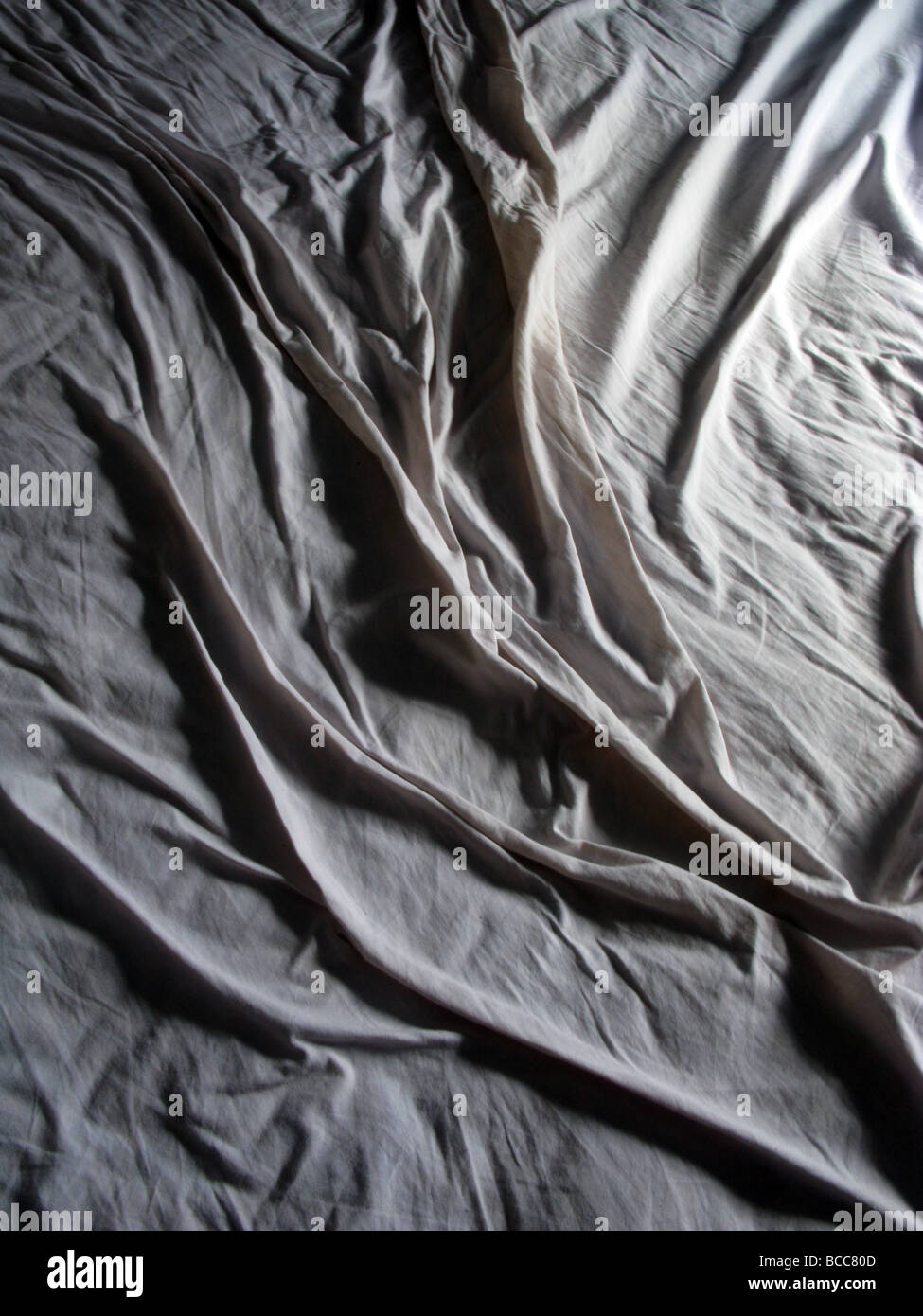 creases on bed sheet in dark room Stock Photo - Alamy