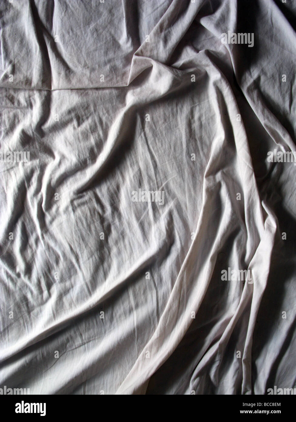 creases on bed sheet in dark room Stock Photo - Alamy