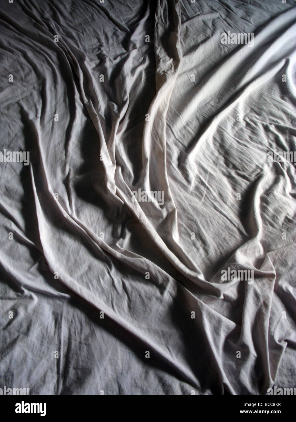 creases on bed sheet in dark room Stock Photo - Alamy