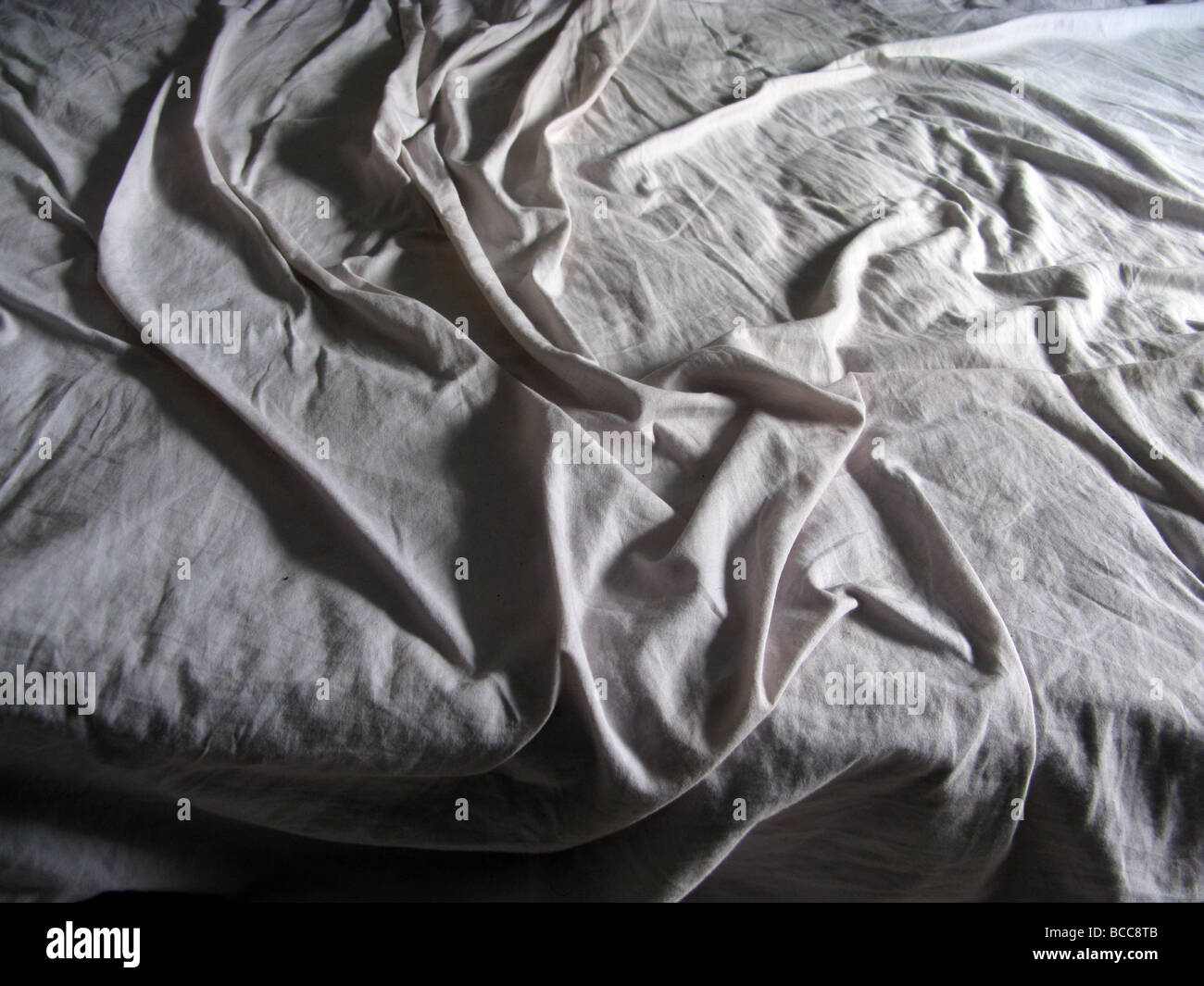 creases on bed sheet in dark room Stock Photo - Alamy