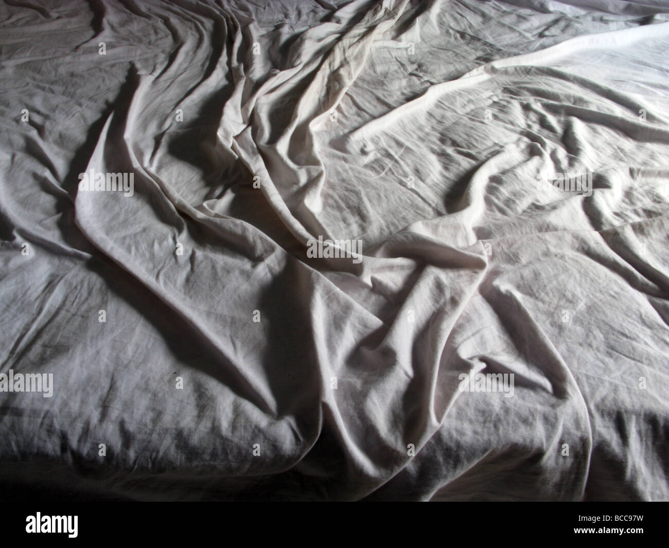 creases on bed sheet in dark room Stock Photo - Alamy