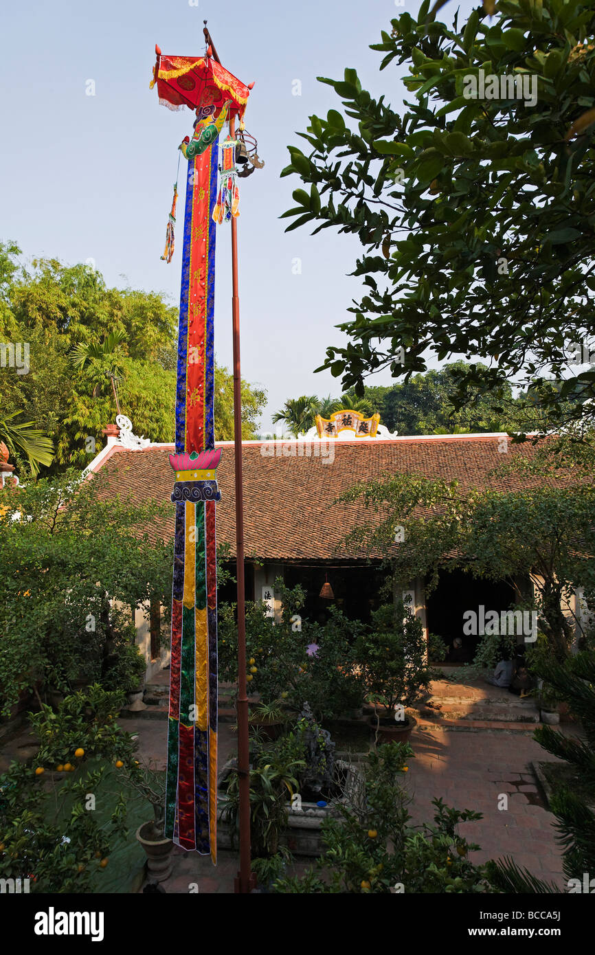 Decorated pole erected in front of the temple next to One Pillar Pagoda ...