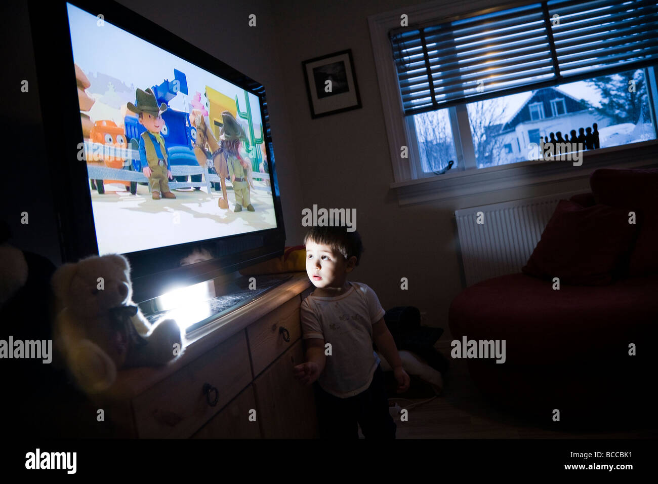 Young boy watching Bob the Builder on television at home Stock Photo ...