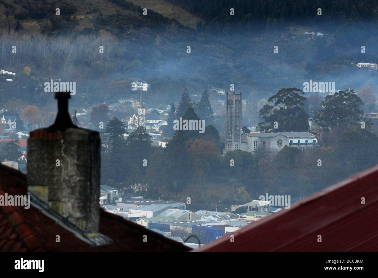 A pall of smog lies over the centre of Nelson, New Zealand, early in ...