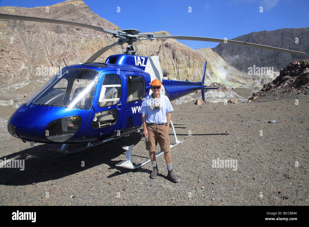 Pilot and helicopter on White Island, Whakaari, a marine volcano in the ...