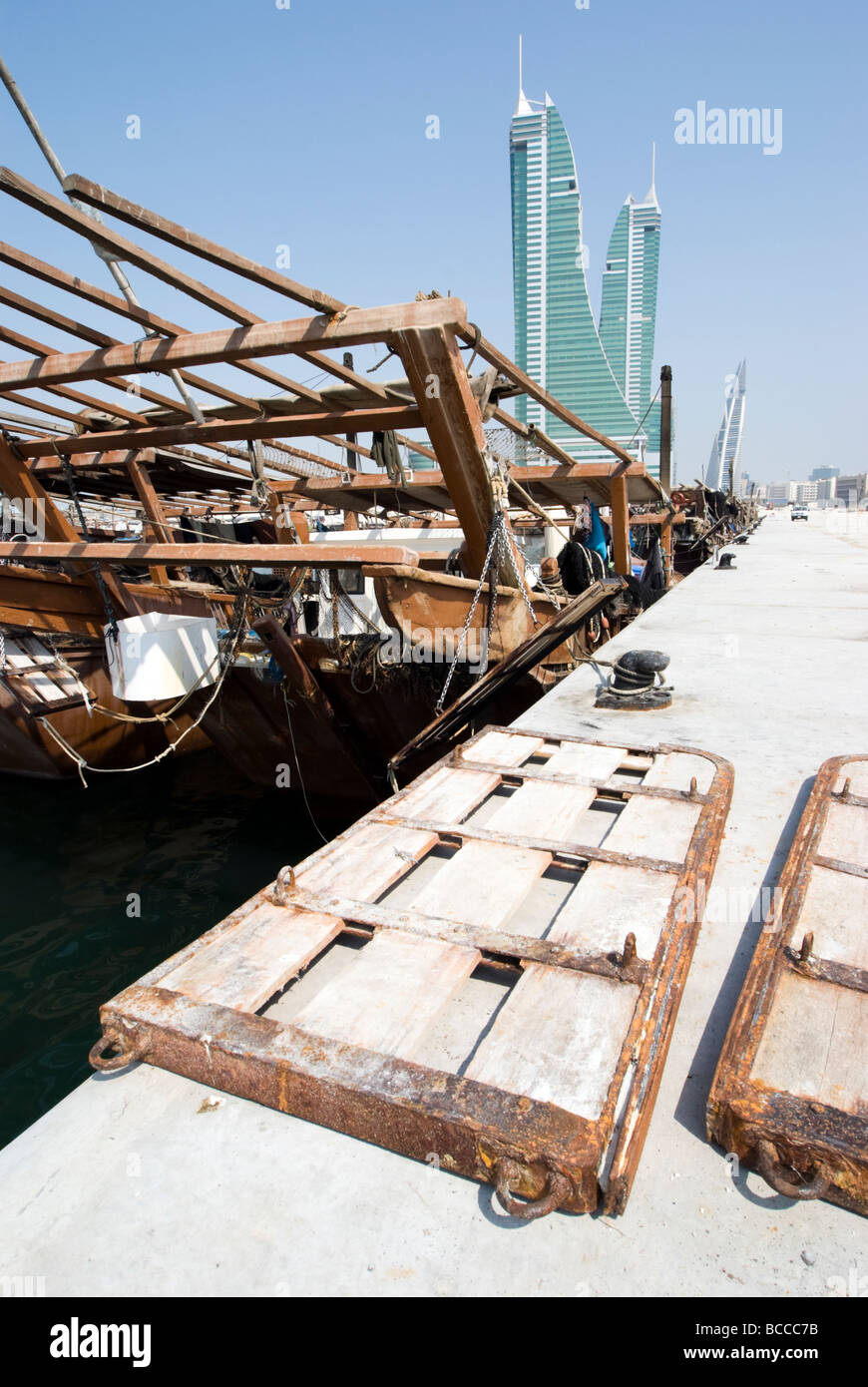 Trade Center towers viewed from coast with fishing boat in foreground ...