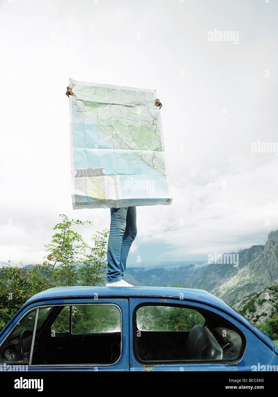 young woman looking at map Stock Photo - Alamy