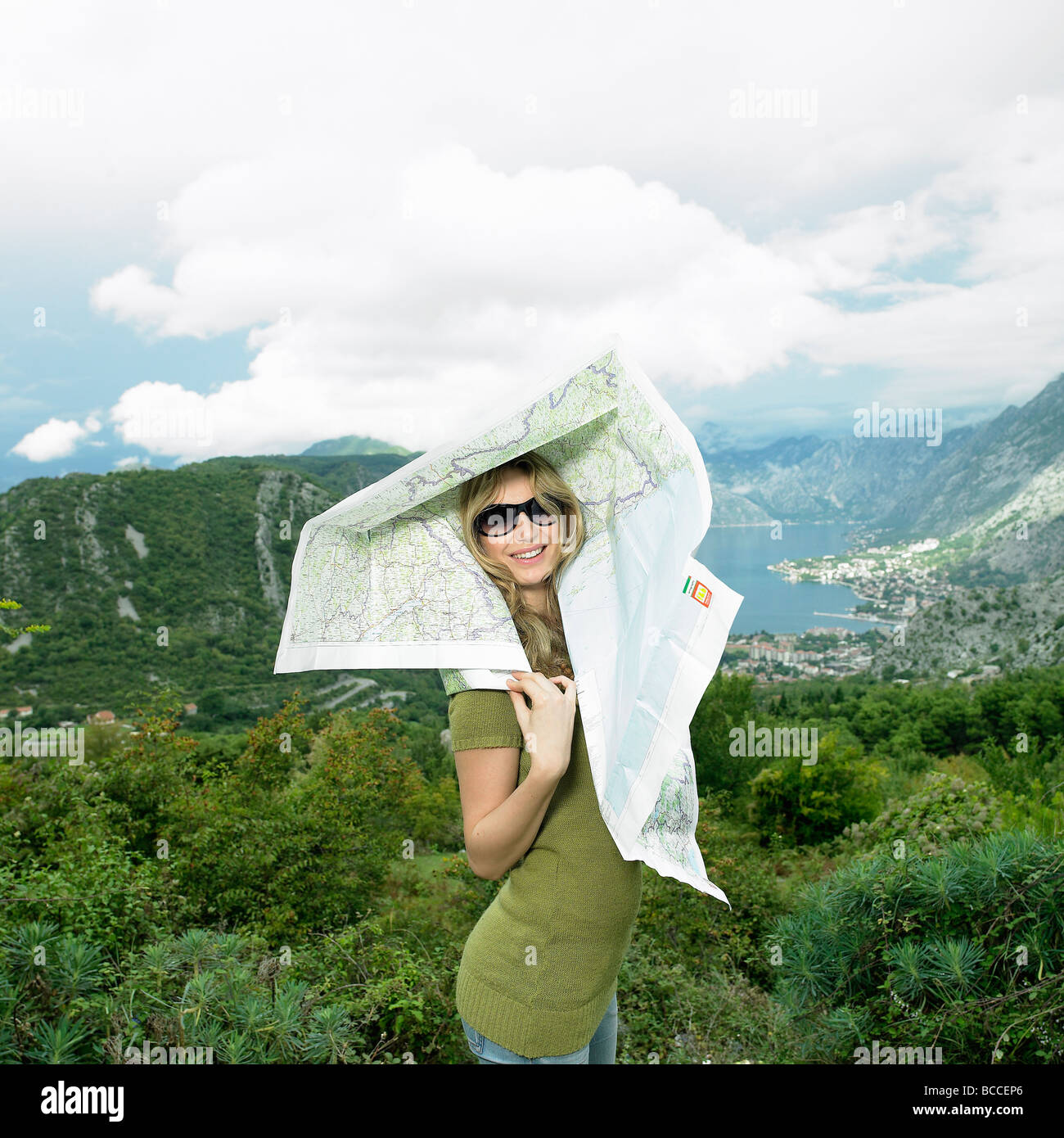 young woman looking at map Stock Photo - Alamy