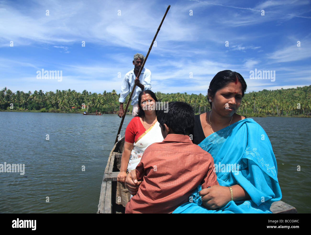 Wooden canoe taking visitors across lake to Ponnumthuruthu island ...