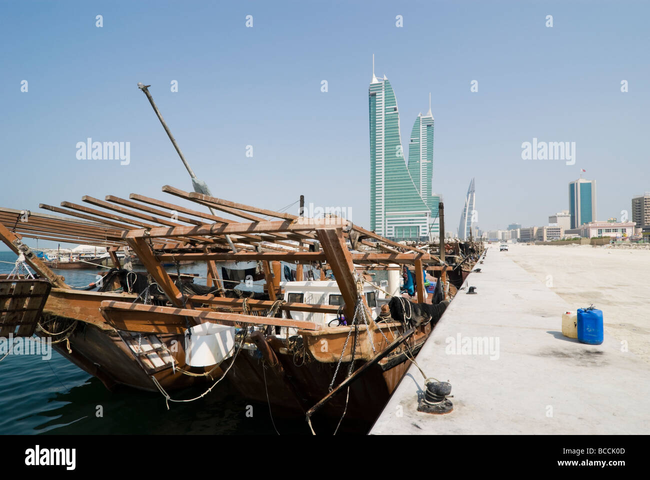 Trade Center towers viewed from coast with fishing boat in foreground ...
